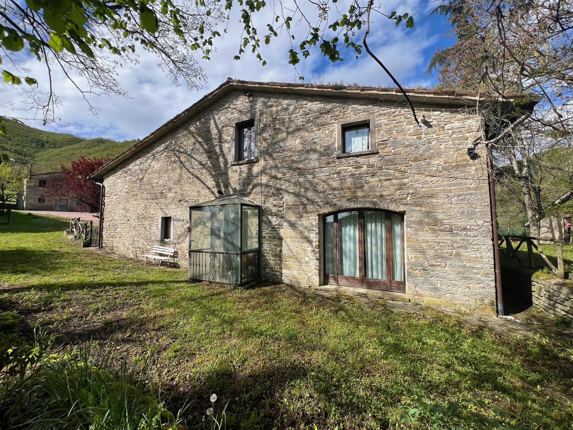 Property consisting of two stone buildings with a garden